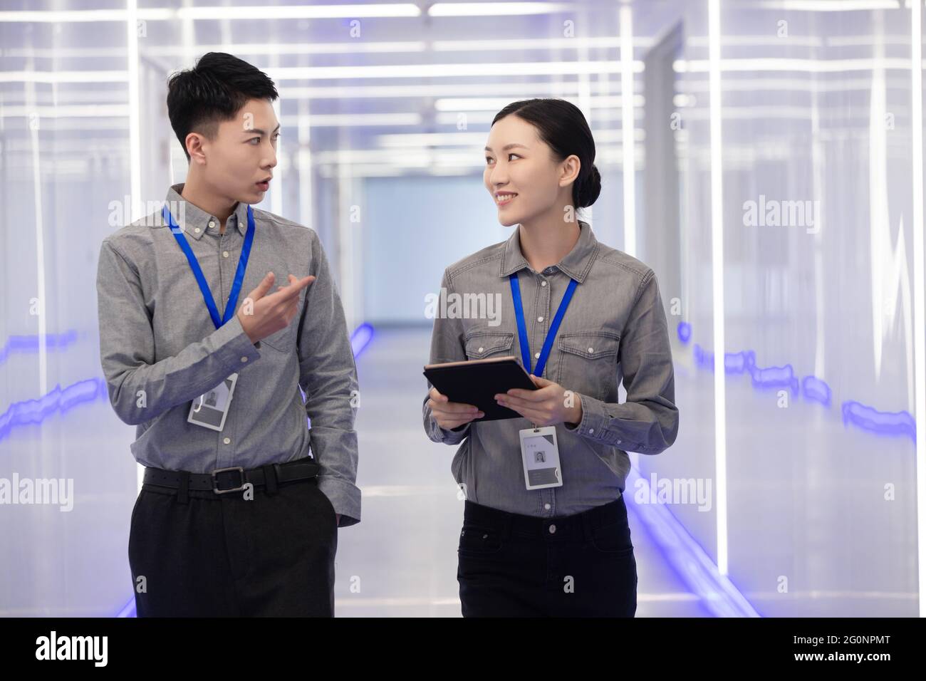 The young technical personnel in the hallway Stock Photo - Alamy