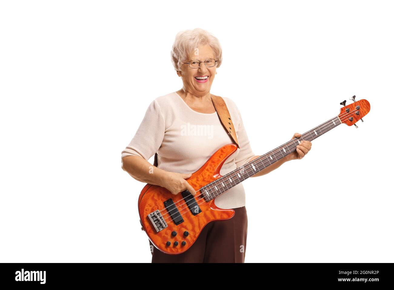 Elderly woman with an electric bass guitar smiling at the camera ...