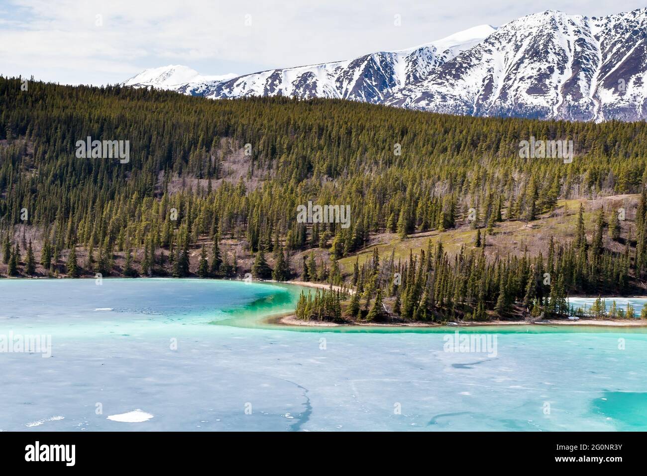Emerald Lake, partially frozen, with Surprise Mountain in the ...