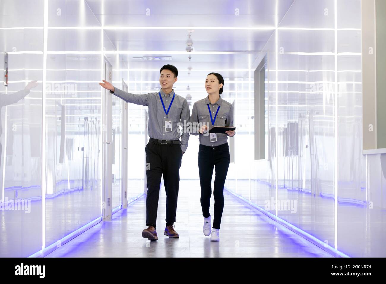 The young technical personnel in the hallway Stock Photo - Alamy
