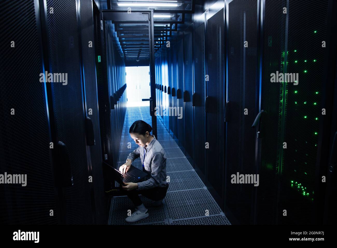 Technicians check the maintenance in the computer room Stock Photo - Alamy