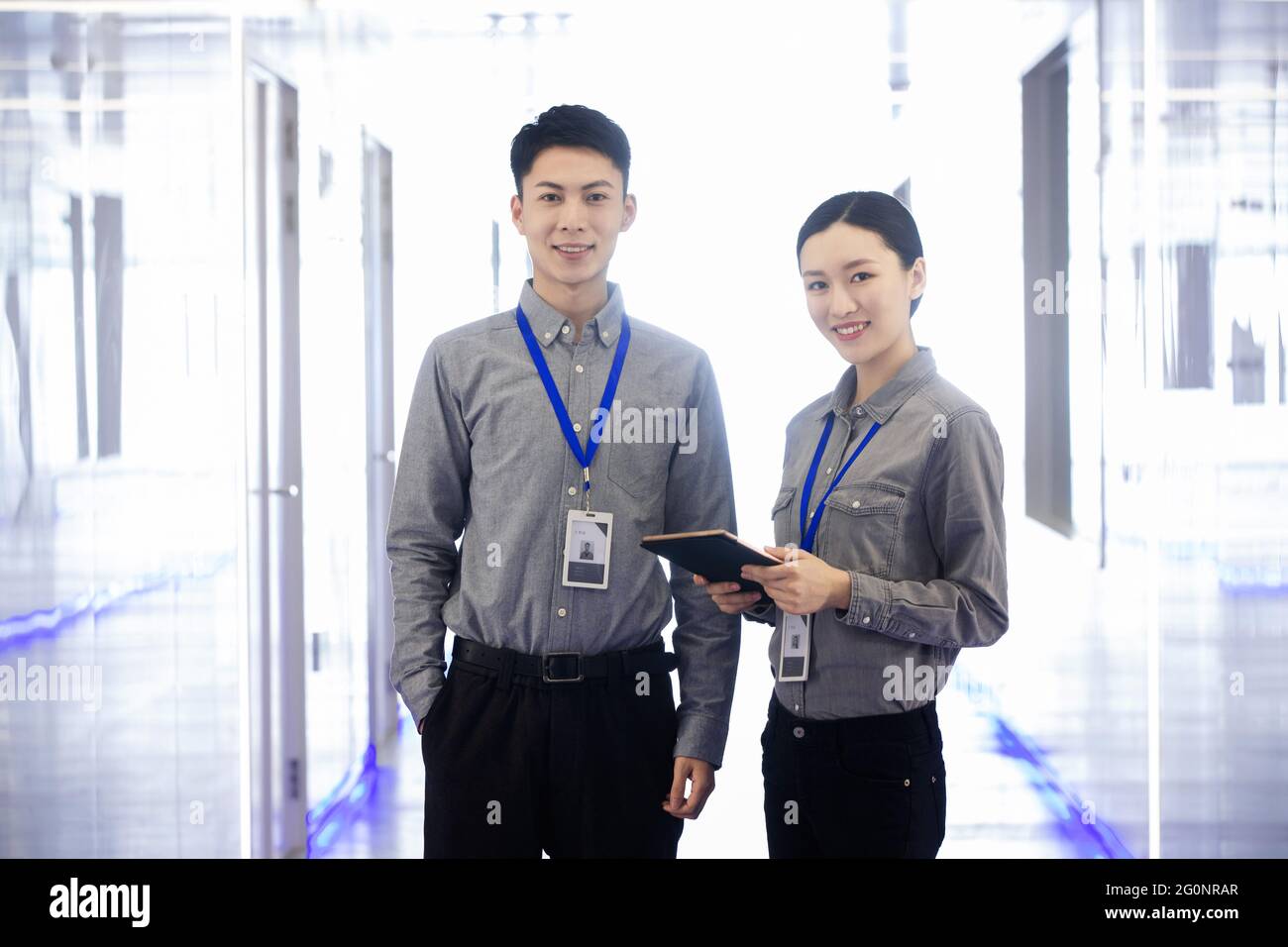 The young technical personnel in the hallway Stock Photo - Alamy