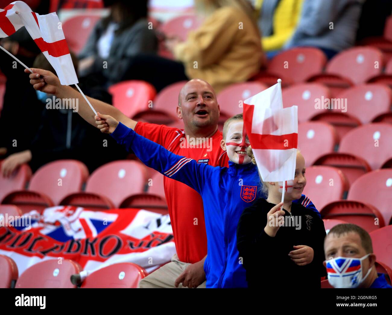 England fans wave flags in the stands during the International Friendly ...