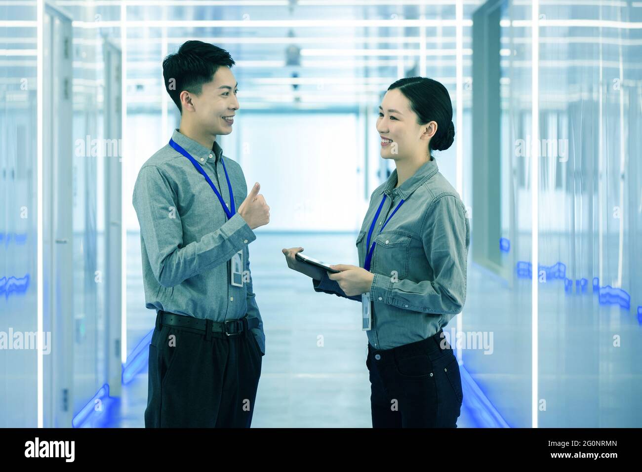 The young technical personnel in the hallway Stock Photo - Alamy