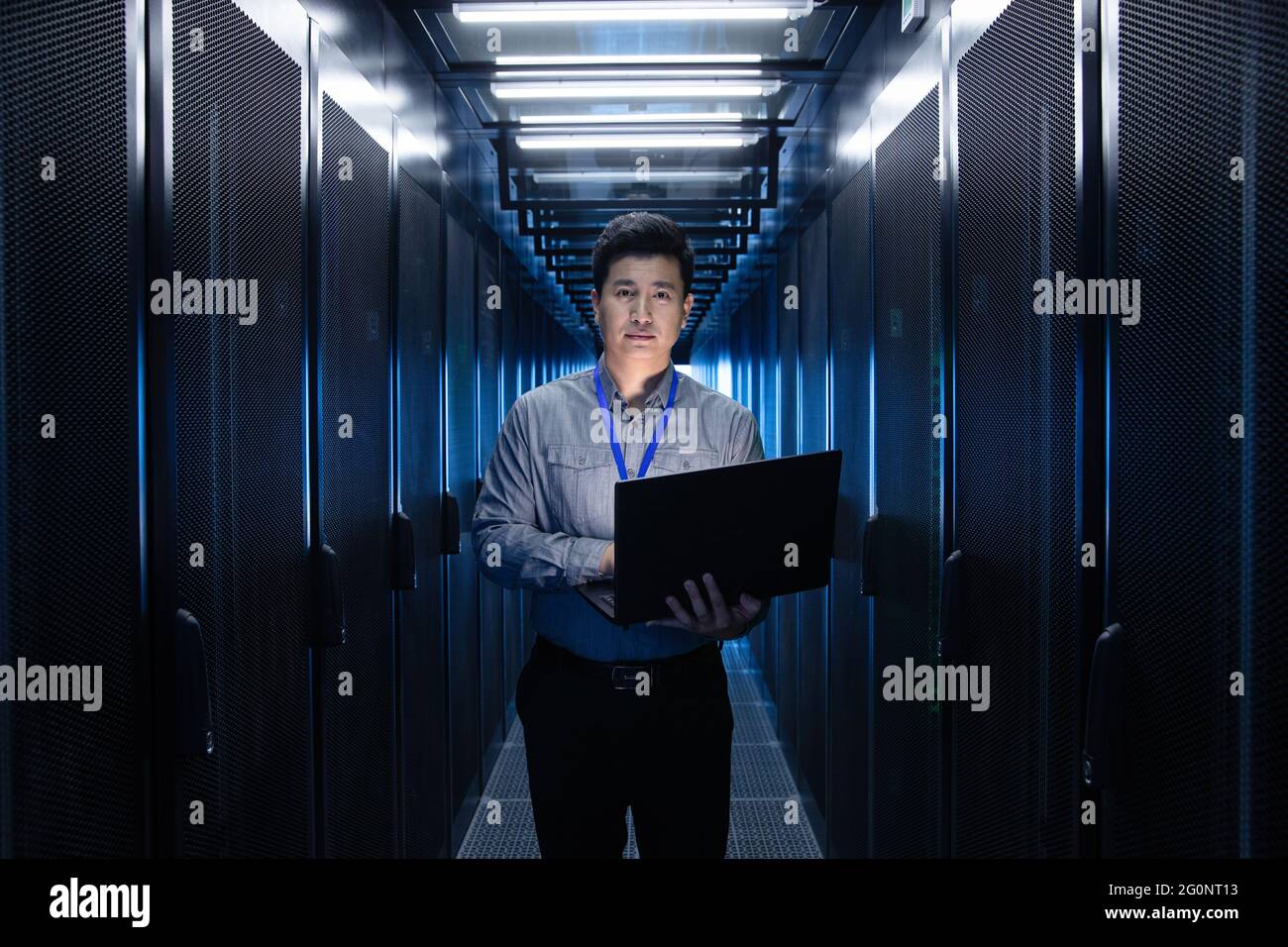 Technicians check the maintenance in the computer room Stock Photo - Alamy