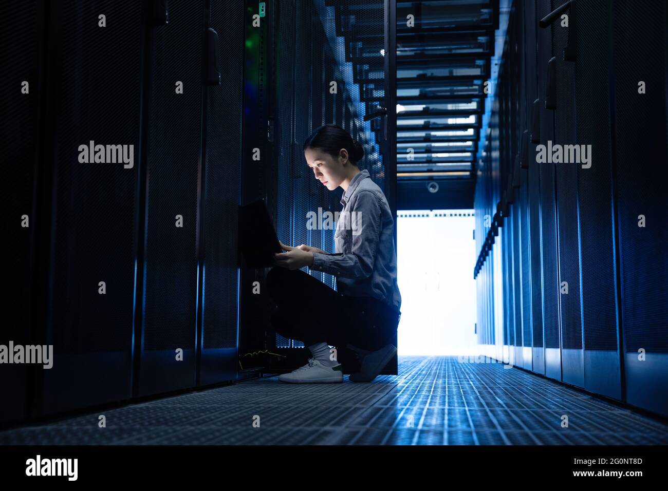 Technicians check the maintenance in the computer room Stock Photo - Alamy