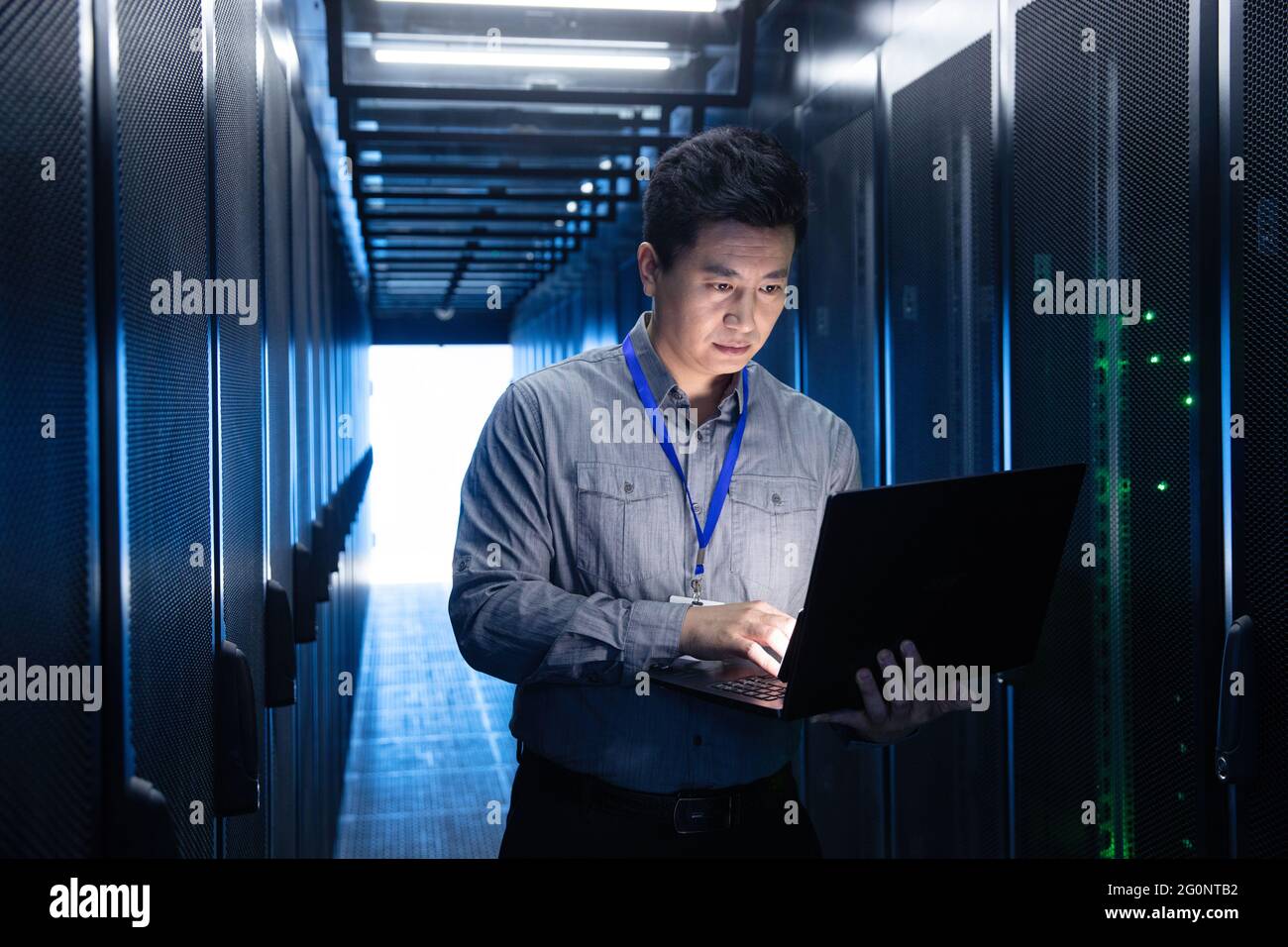 Technicians check the maintenance in the computer room Stock Photo - Alamy