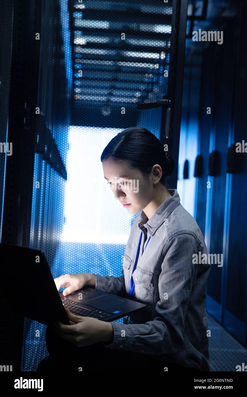 Technicians check the maintenance in the computer room Stock Photo - Alamy