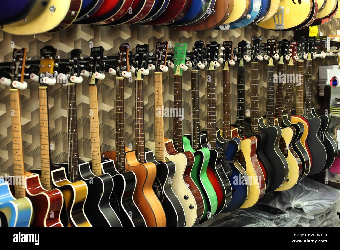 Guitars seen on shelves at a store.Due to the corona virus crisis and lockdown, many musicians ...