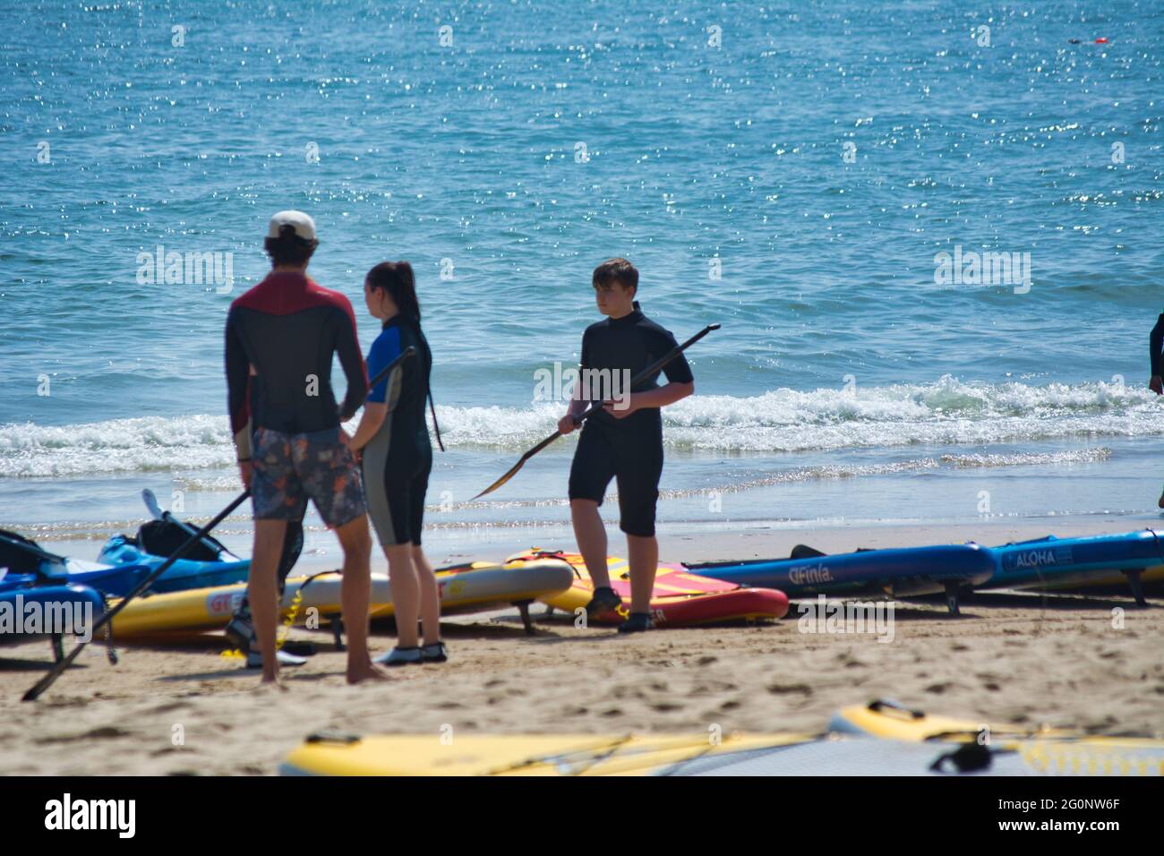 Paddle boarding lesson in Tenby,Wales,UK Stock Photo - Alamy