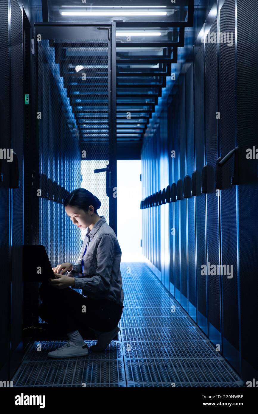 Technicians check the maintenance in the computer room Stock Photo - Alamy