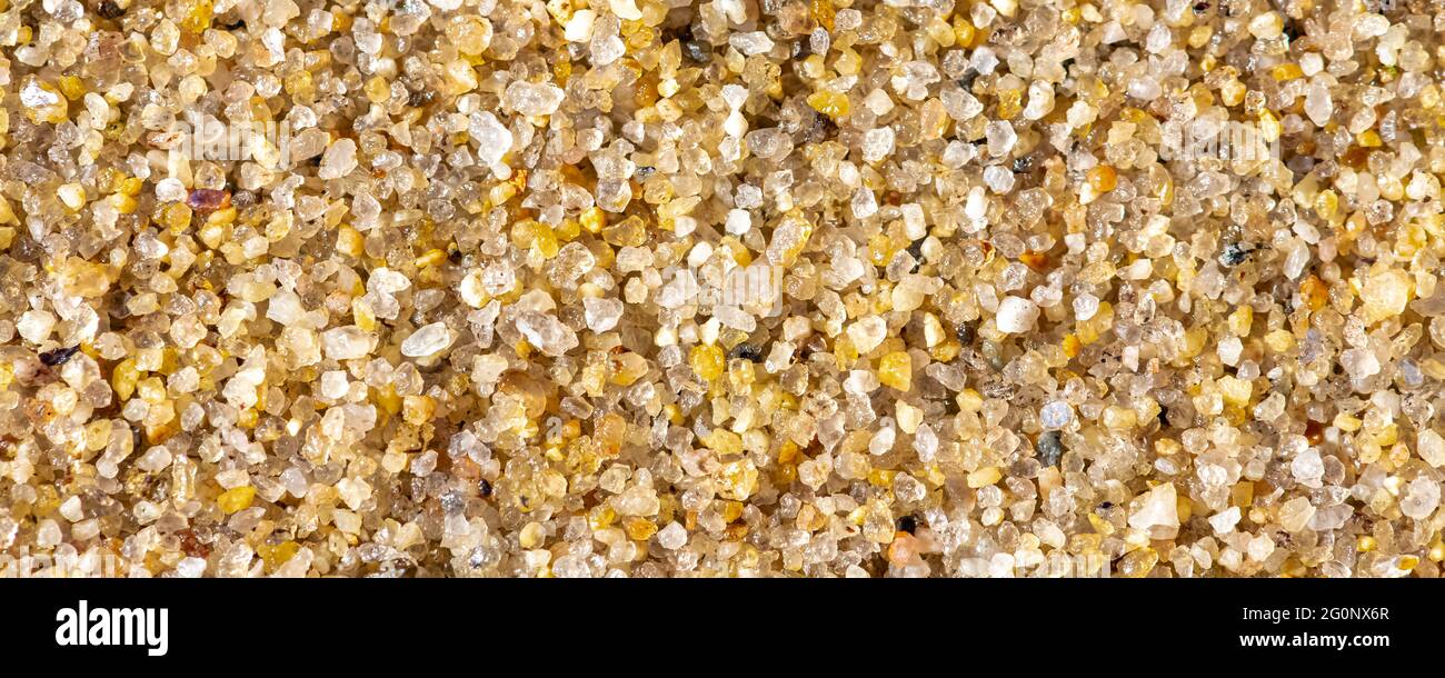 Large grains of sand on a beach, colorful background Stock Photo - Alamy