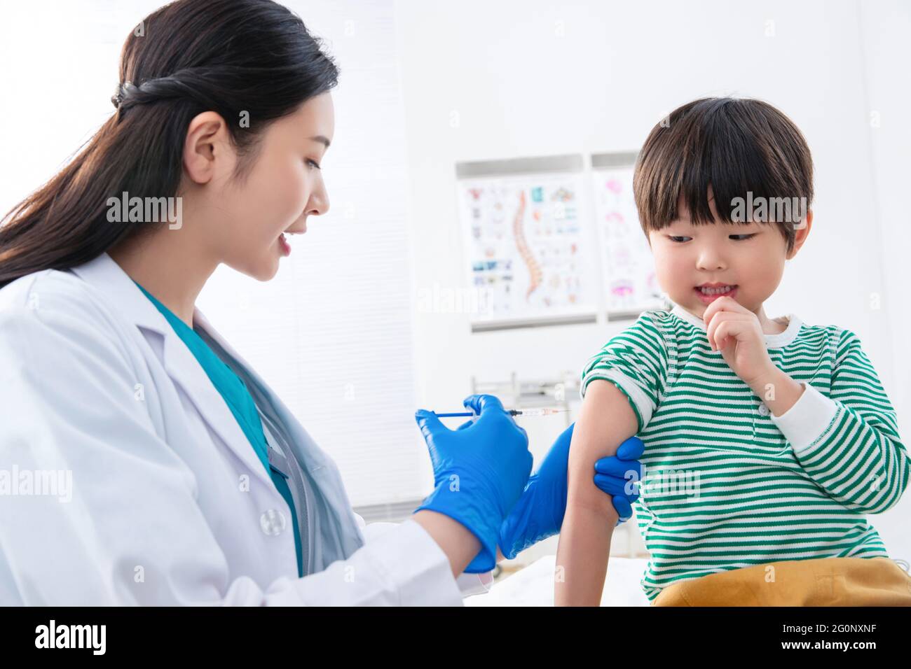 The doctor gave the boy an injection Stock Photo - Alamy
