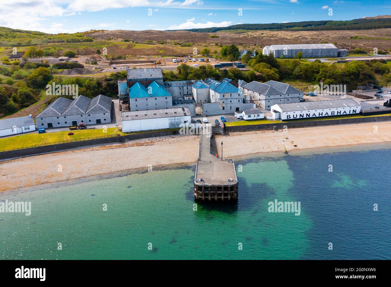 Aerial view from drone of Bunnahabhain scotch whisky distillery of ...