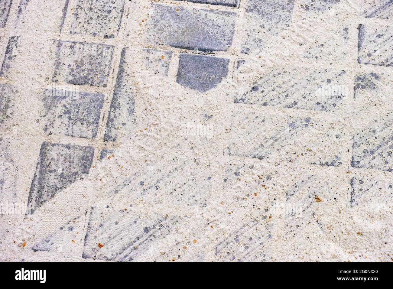 Sand laying on stone tiles. Full frame Stock Photo - Alamy