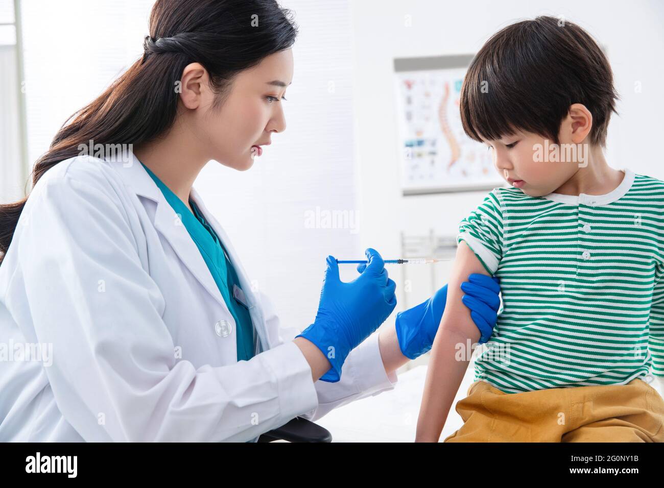 The doctor gave the boy an injection Stock Photo - Alamy