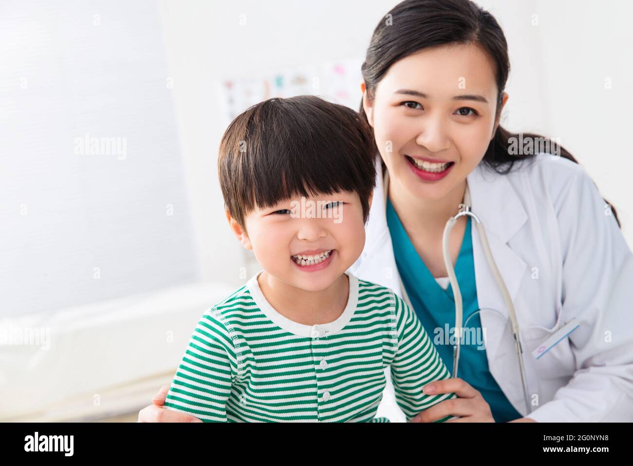 Happy little boy and a doctor Stock Photo - Alamy
