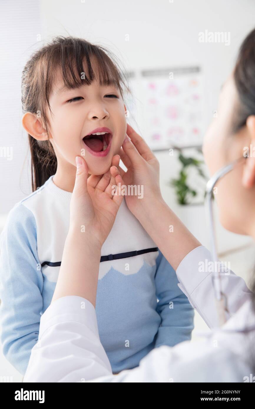 Young female doctor to check body little girl Stock Photo - Alamy