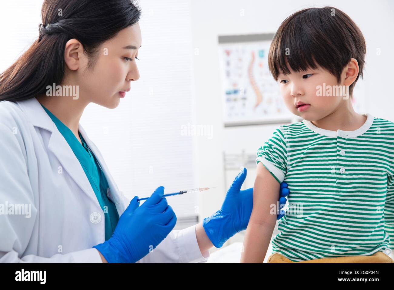 The doctor gave the boy an injection Stock Photo - Alamy