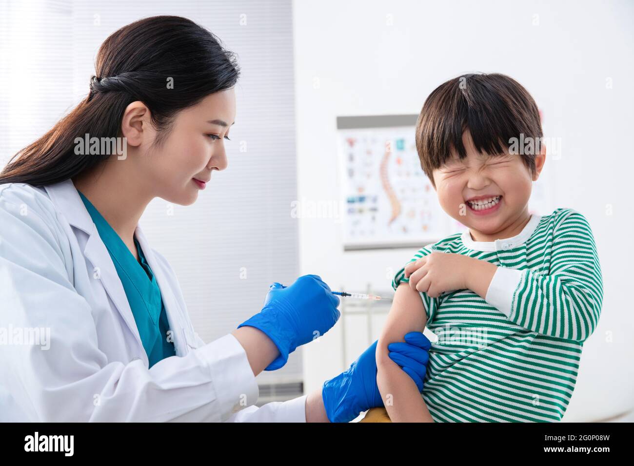 Asia doctor boy injection hi-res stock photography and images - Alamy