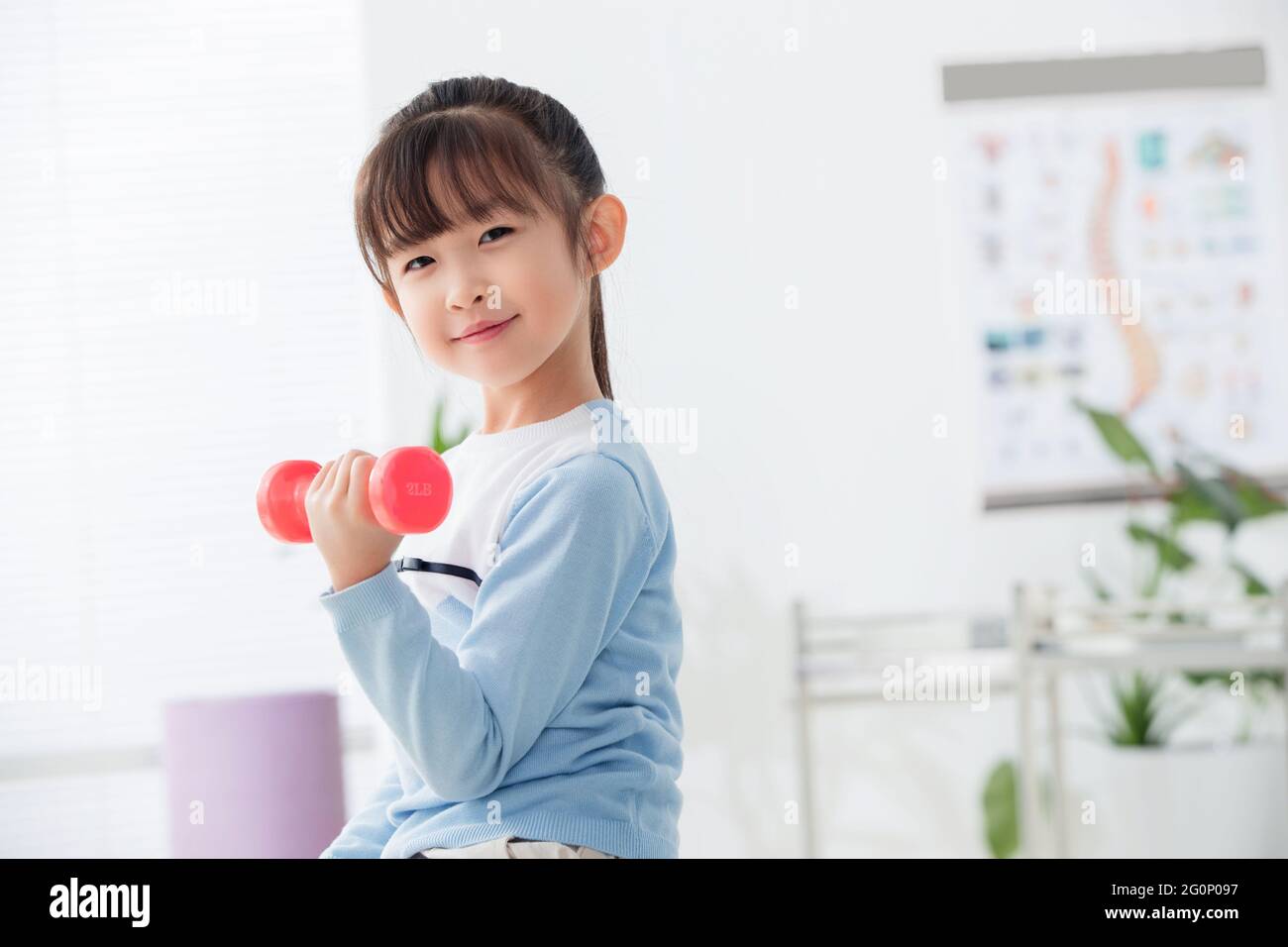 The little girl to take exercise Stock Photo - Alamy