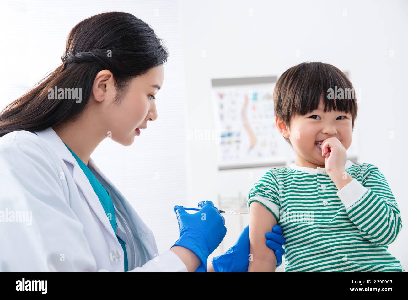 The doctor gave the boy an injection Stock Photo - Alamy