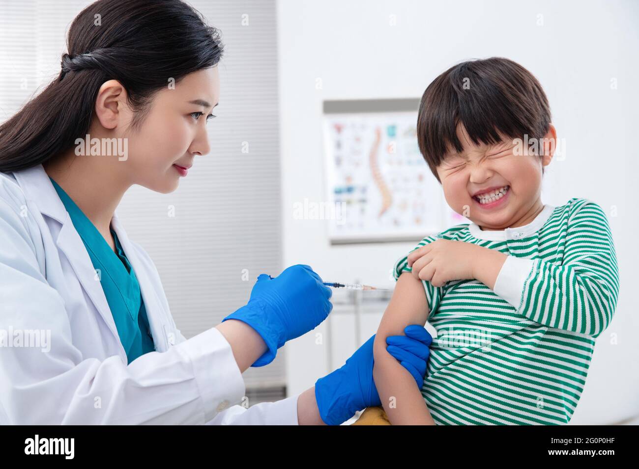 The doctor gave the boy an injection Stock Photo - Alamy