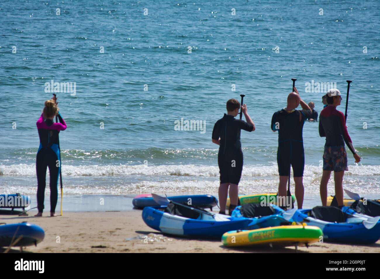 Paddle boarding lesson in Tenby,Wales,UK Stock Photo - Alamy