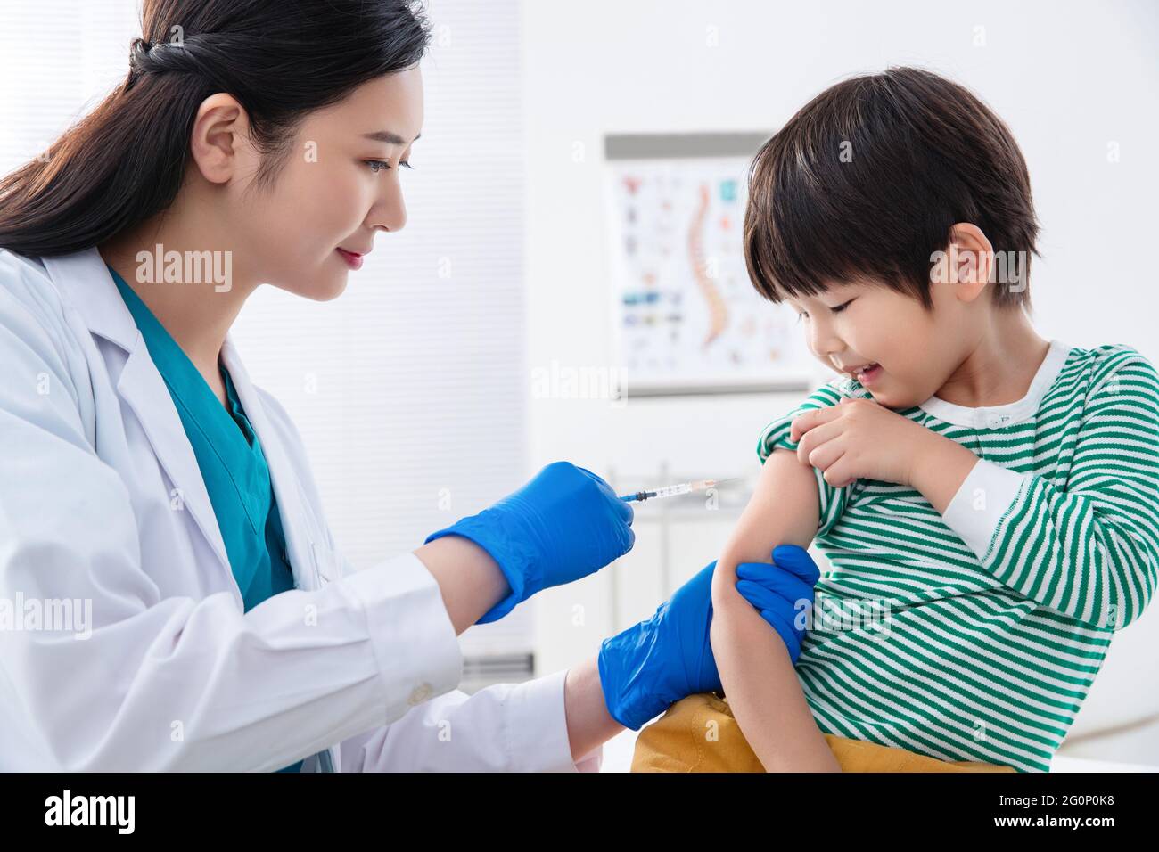The doctor gave the boy an injection Stock Photo - Alamy