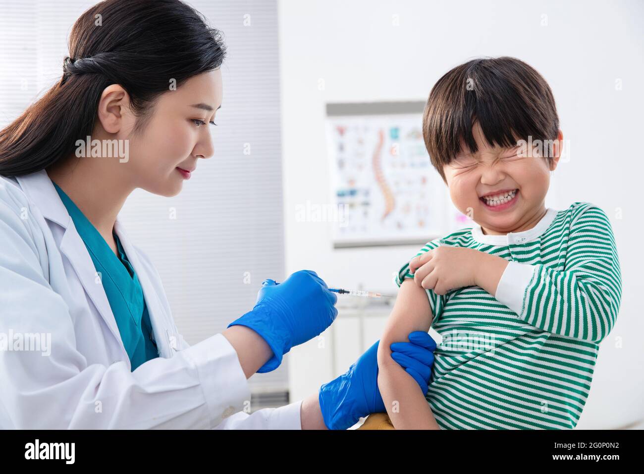 The doctor gave the boy an injection Stock Photo - Alamy
