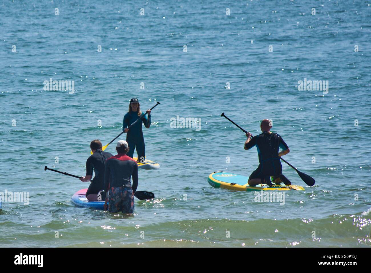Paddle boarding lesson in Tenby,Wales,UK Stock Photo - Alamy