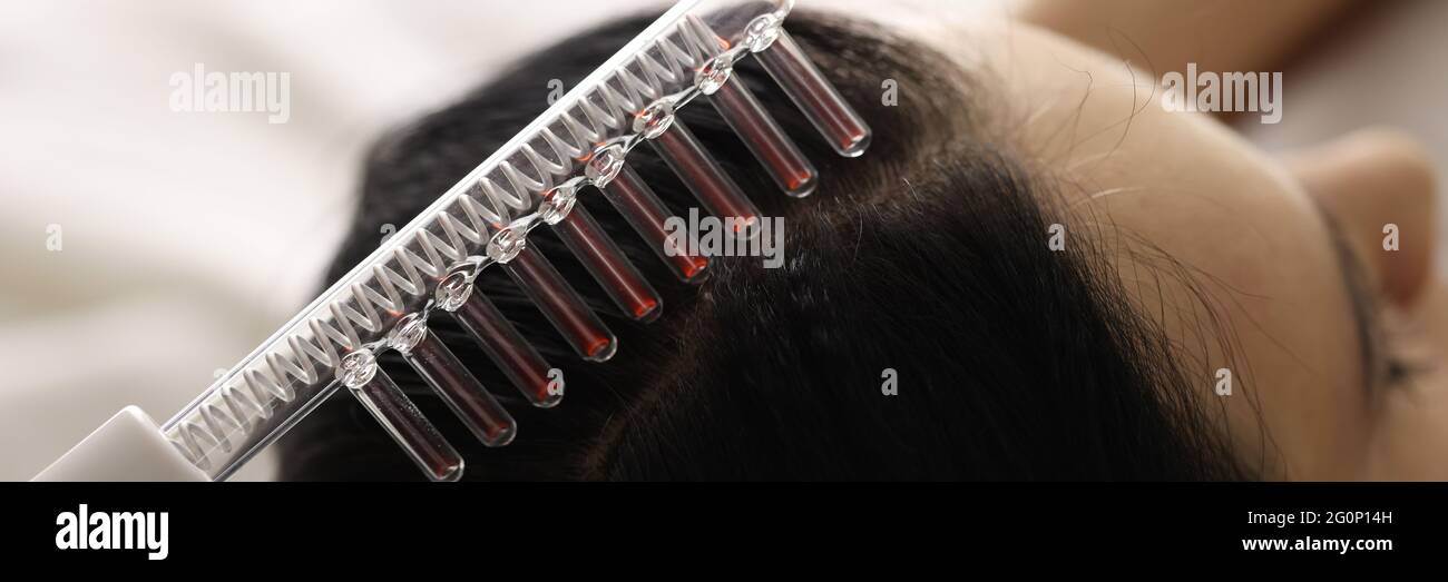 Woman is doing hair strengthening procedures closeup Stock Photo - Alamy