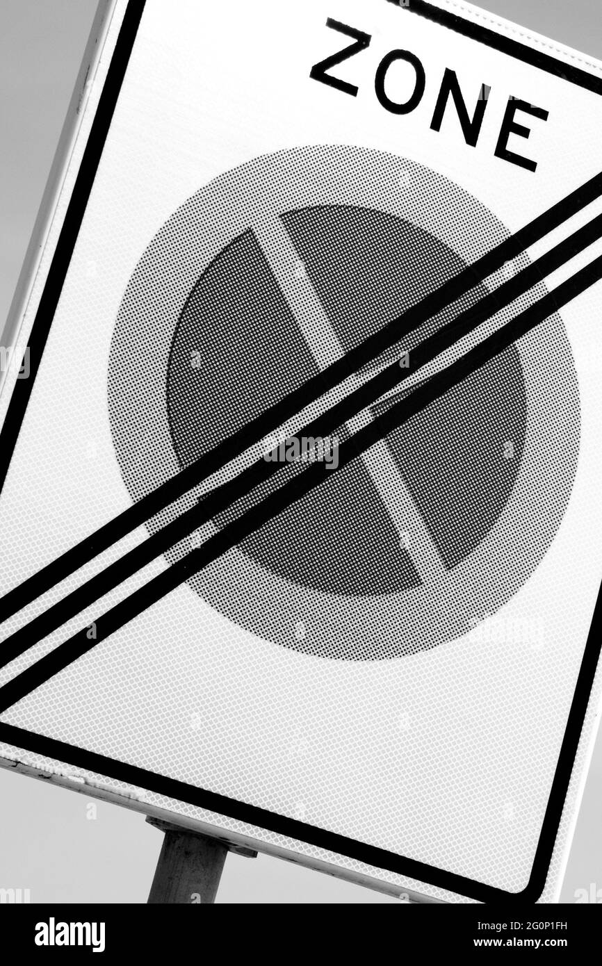 Black and white shot of the parking sign with the text of "zone Stock ...