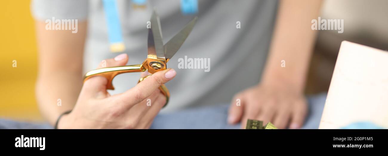 Holds scissors hi-res stock photography and images - Alamy