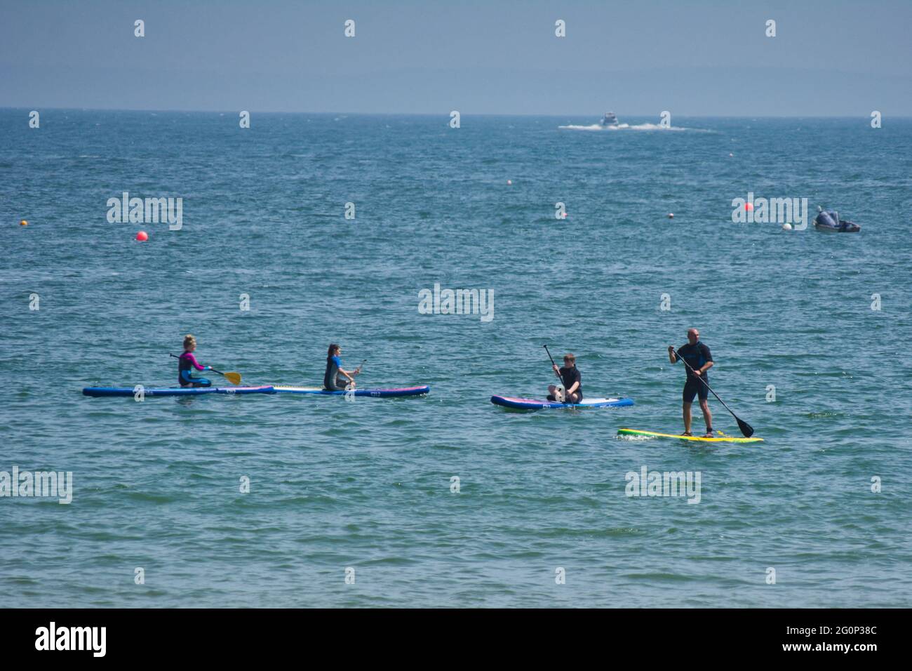 Paddle boarding lesson in Tenby,Wales,UK Stock Photo - Alamy