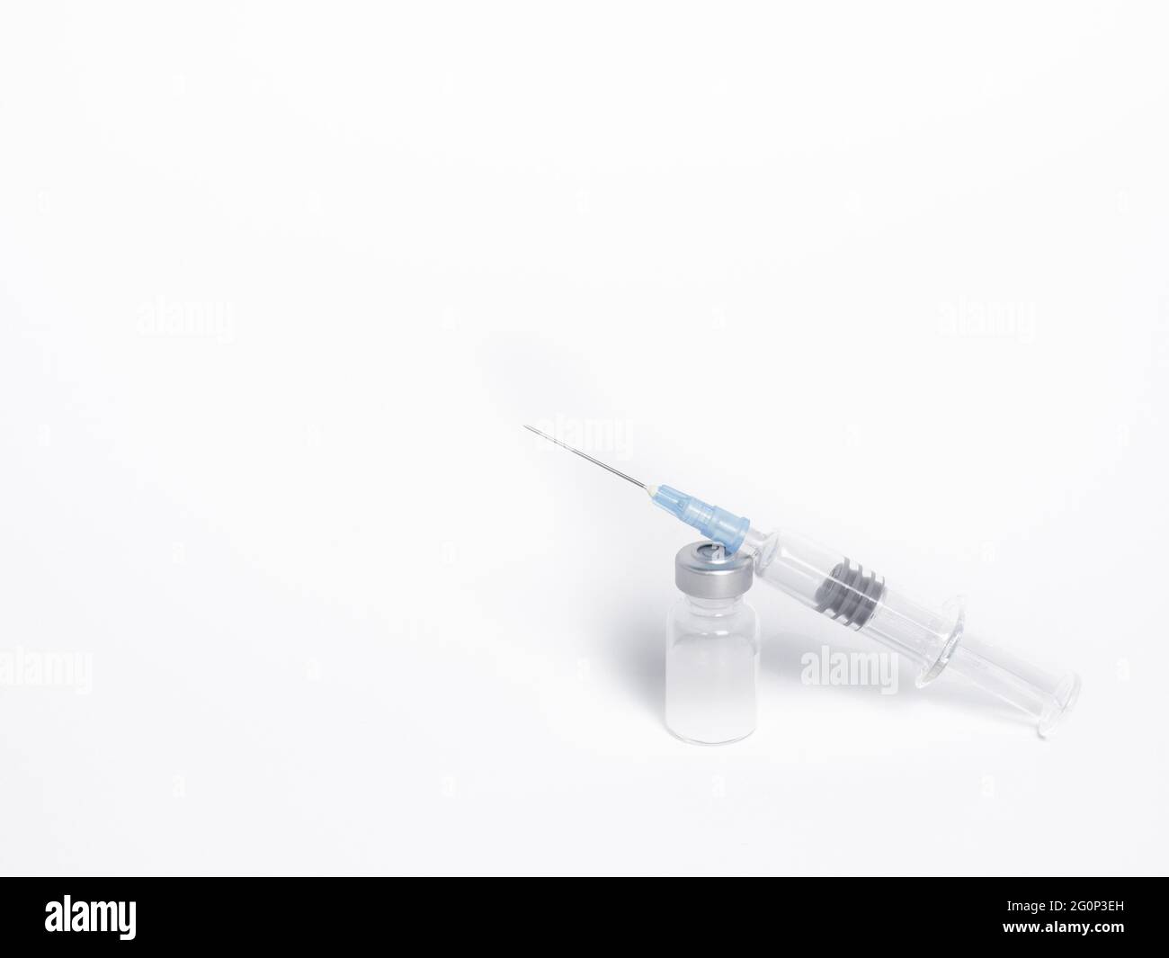 Medical vial for injection with a syringe on white background Stock ...