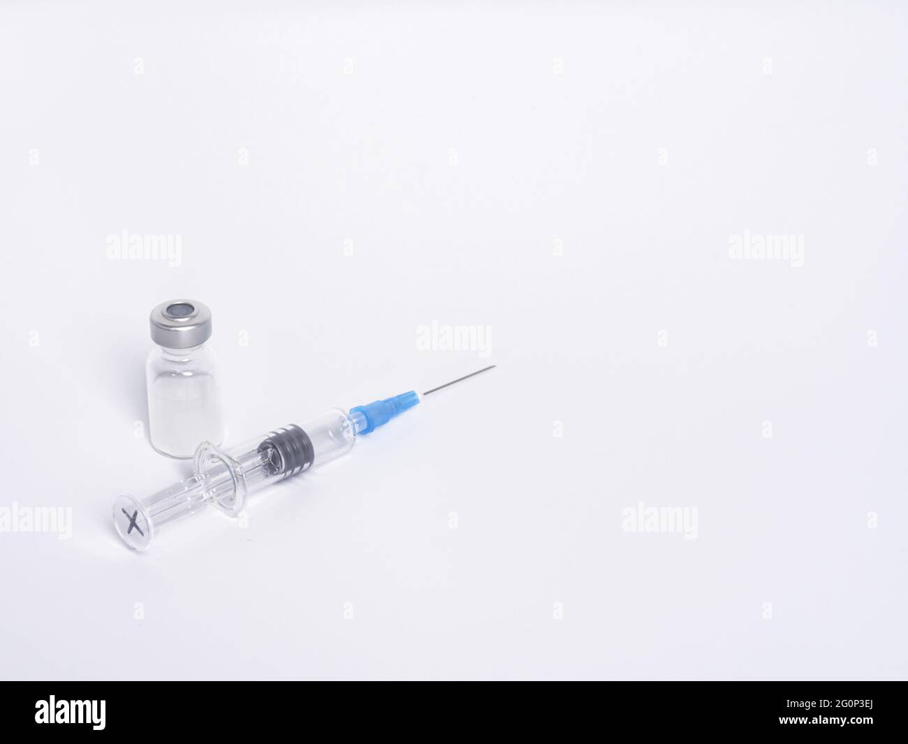 Medical vial for injection with a syringe on white background Stock ...