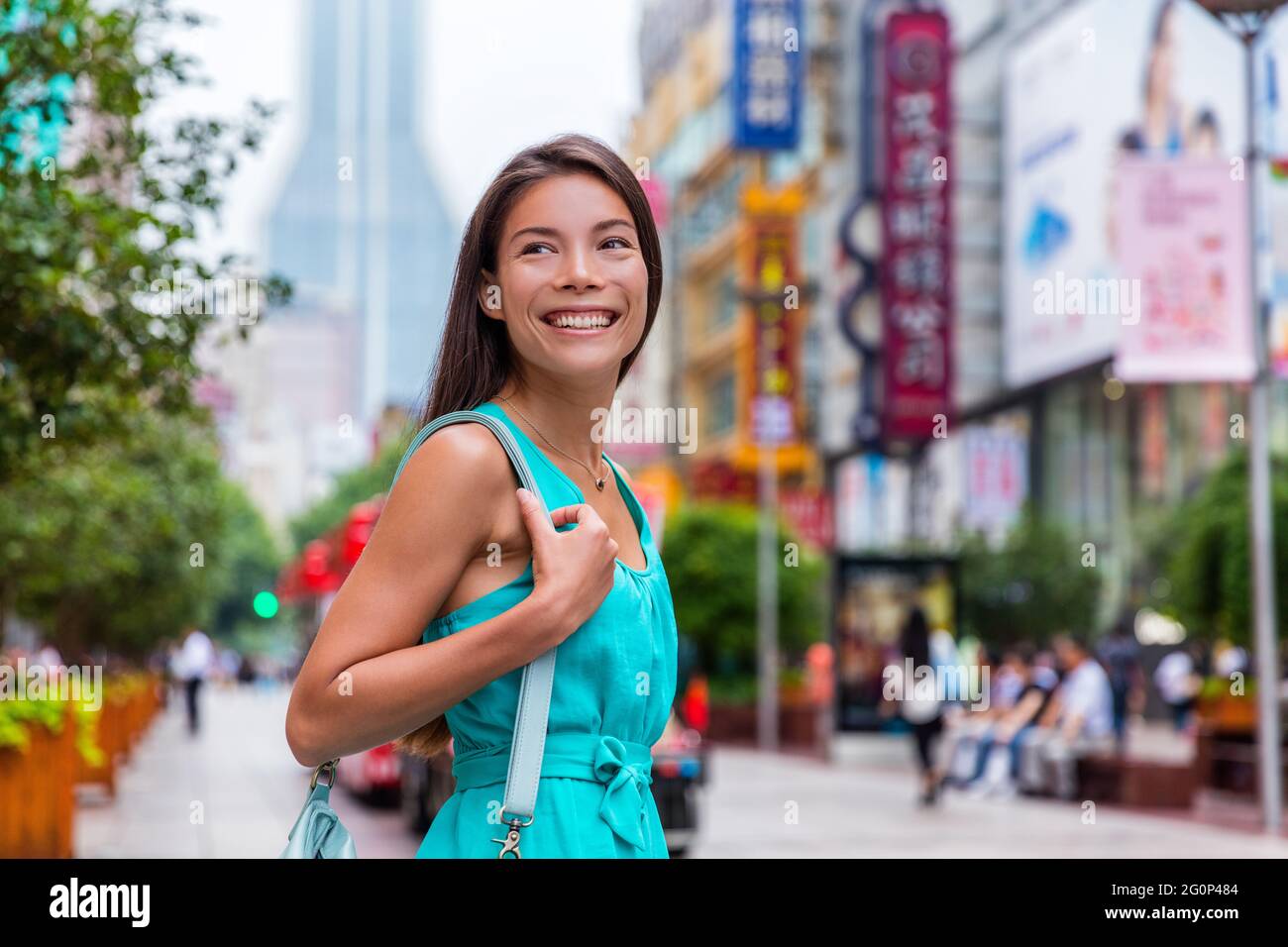 Chinese woman shopping on Nanjing Road Shanghai city, China. Happy girl ...