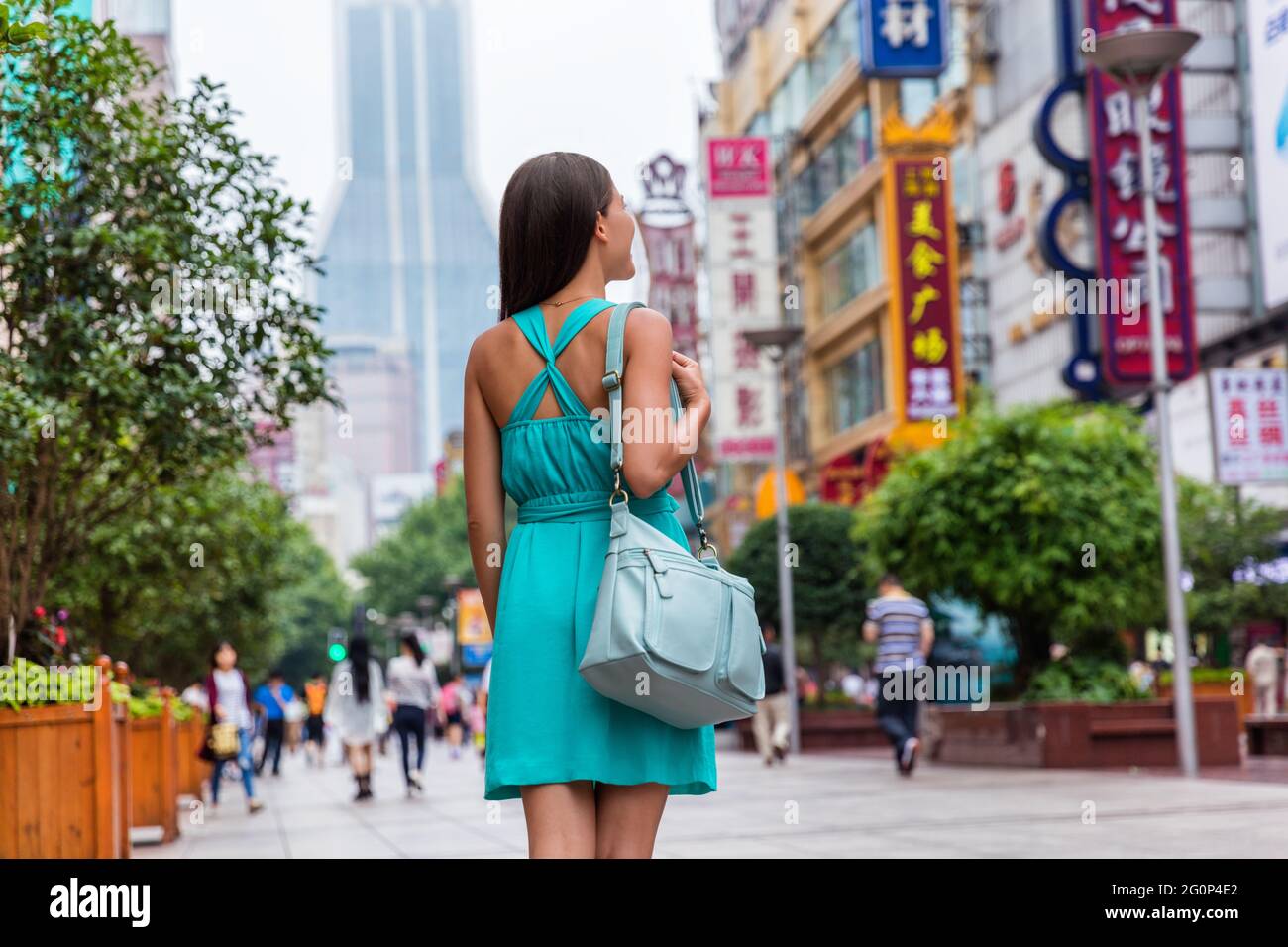 Chinese girl walking on road hi-res stock photography and images - Alamy