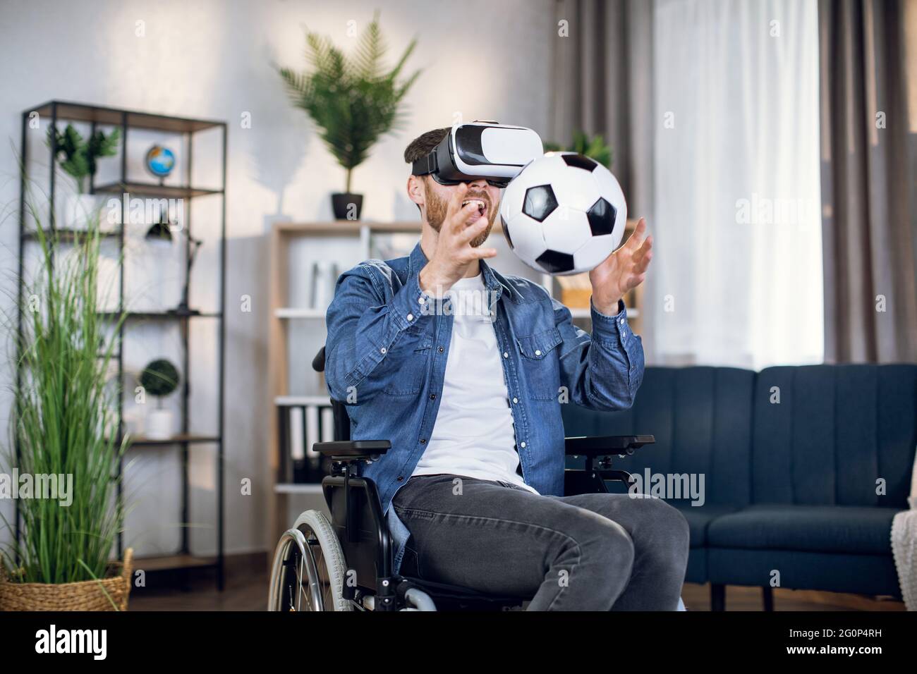 Wheelchair playing football hi-res stock photography and images - Alamy