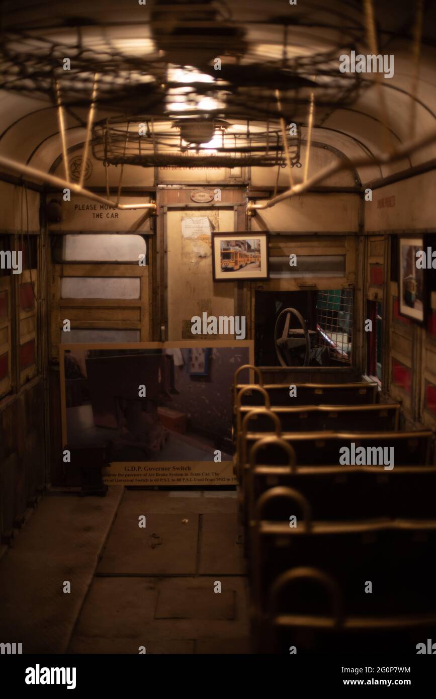Vertical shot of the interior of an old vintage bus with photos on the ...