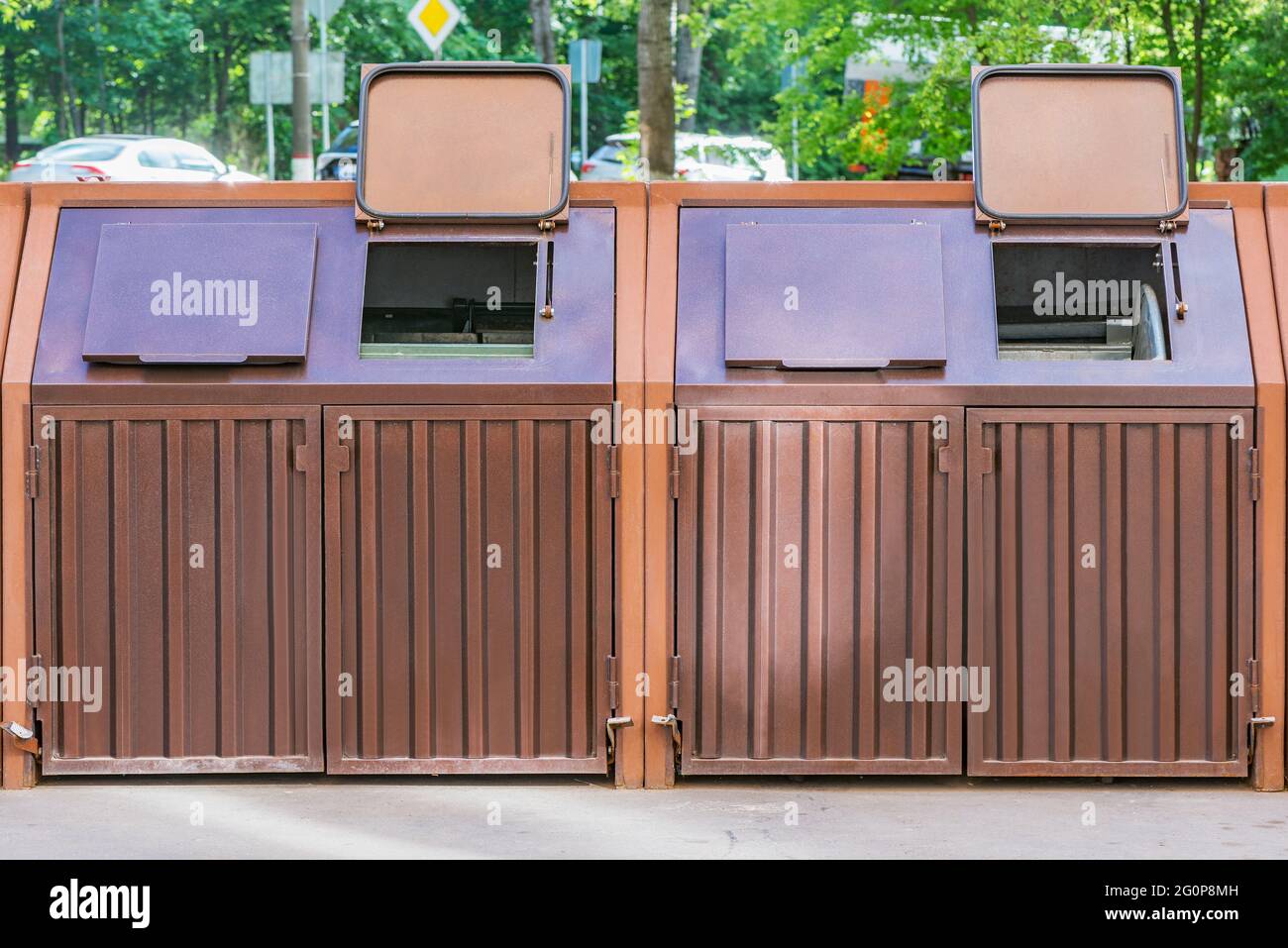 Metal containers for the waste collection by the supermarket bullding ...