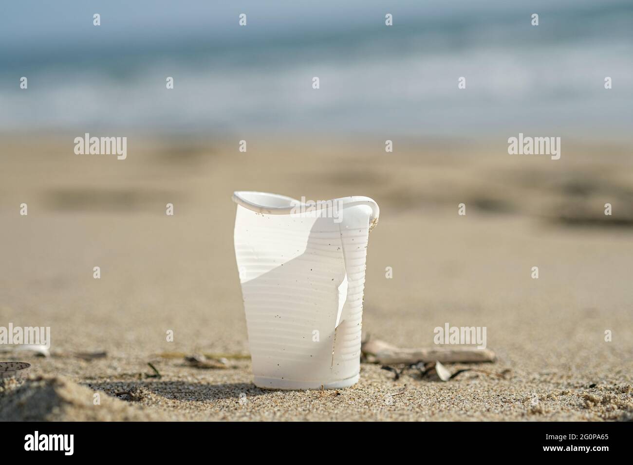 Isolated plastic cup discarded on sea coast ecosystem,nature waste ...