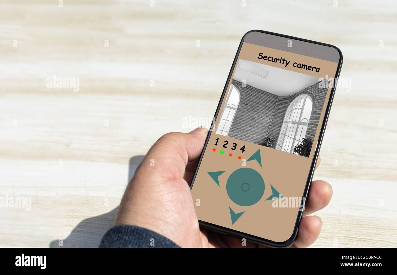 person using a mobile phone application to monitor the security cameras ...