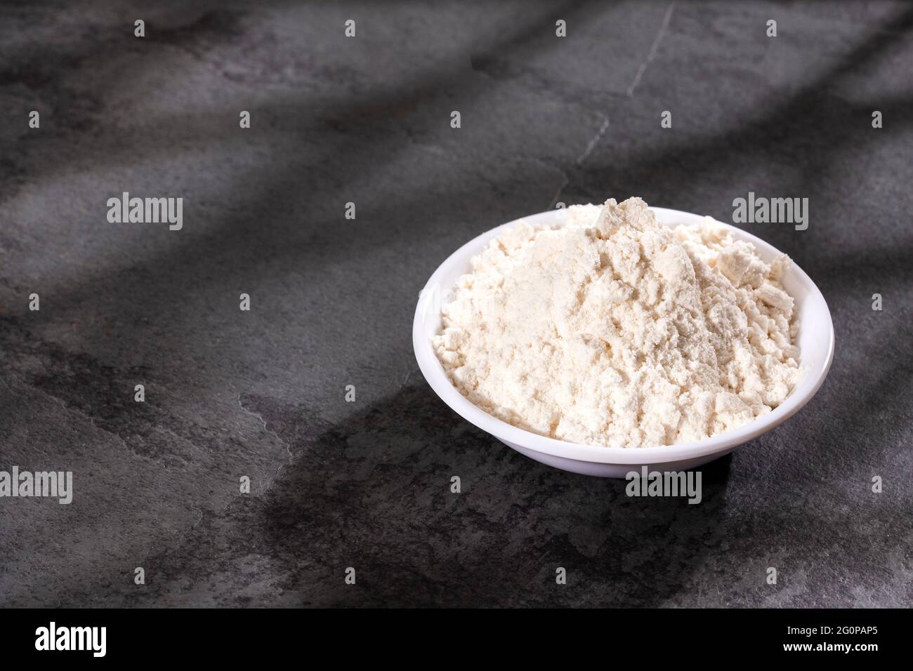 Fortified wheat flour in the bowl - Text space Stock Photo - Alamy