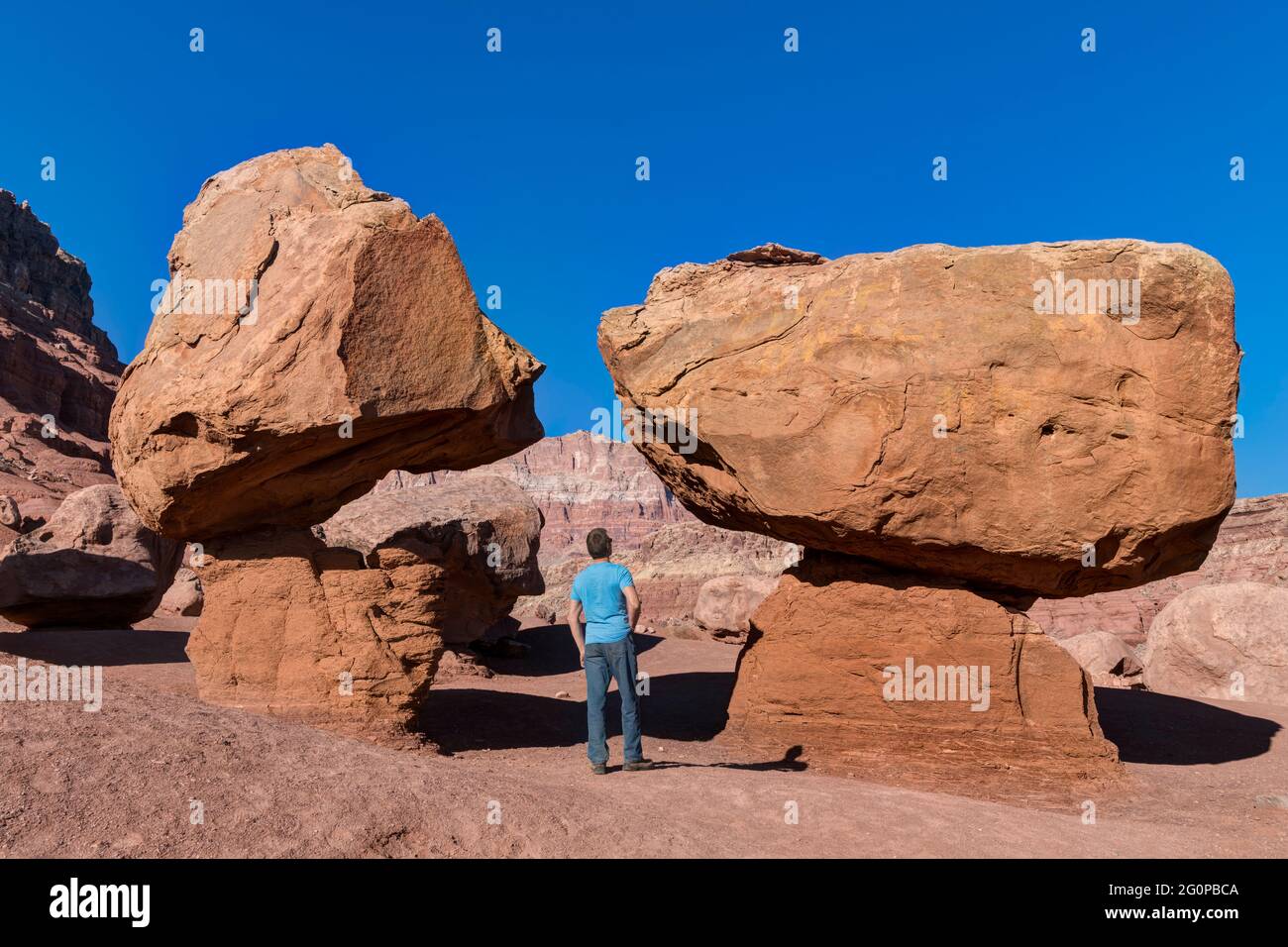 Man looking up at Balanced Rock, Marble Canyon, Arizona, USA Stock ...