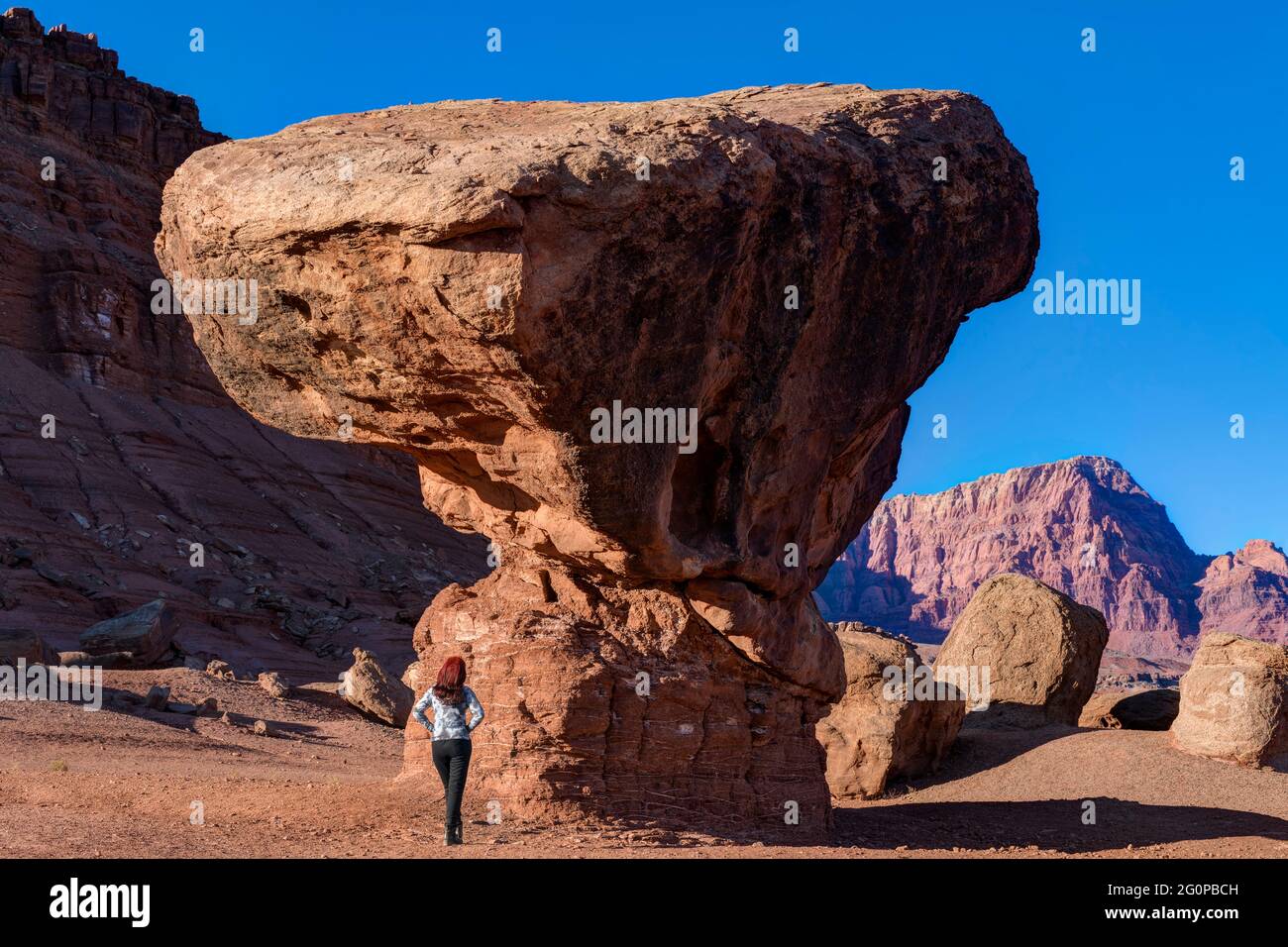 Woman looking up at Balanced Rock, Marble Canyon, Arizona, USA Stock ...