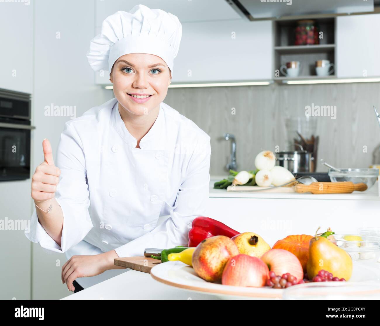 Young glad professional cook hi-res stock photography and images - Alamy