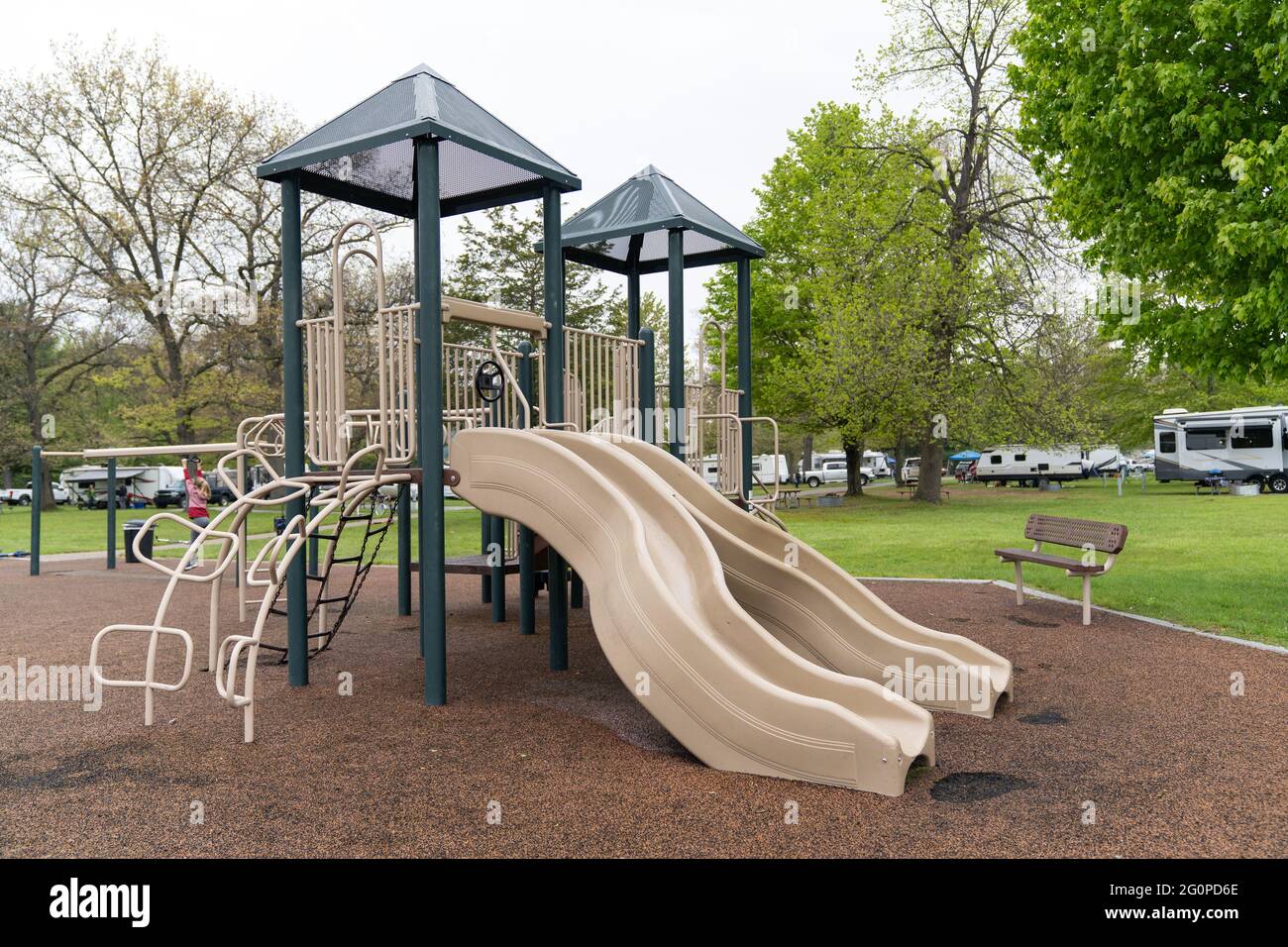 Children playground in public park surrounded by green trees Stock ...