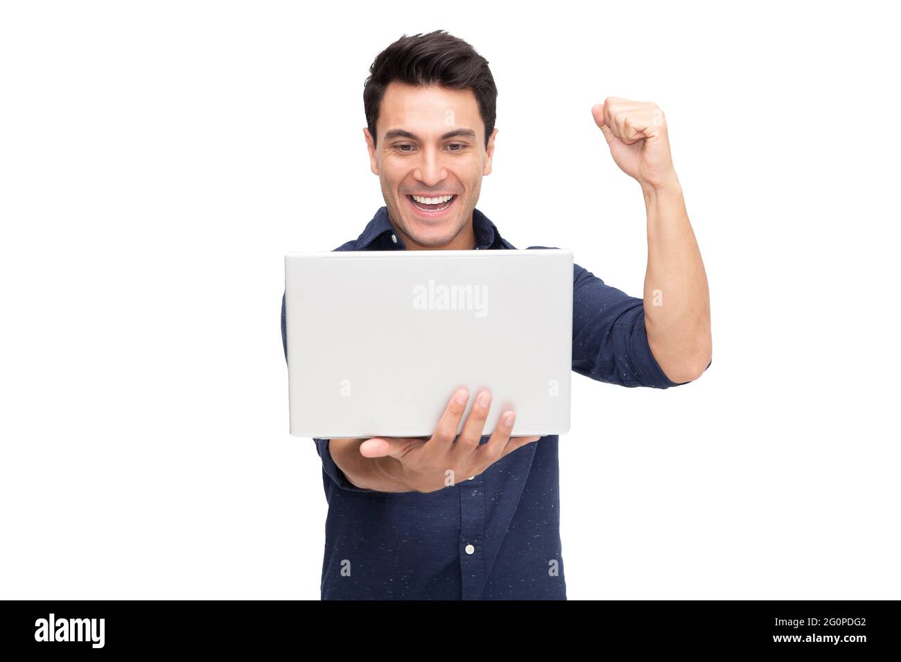 Portrait of an excited man holding laptop computer and celebrating ...
